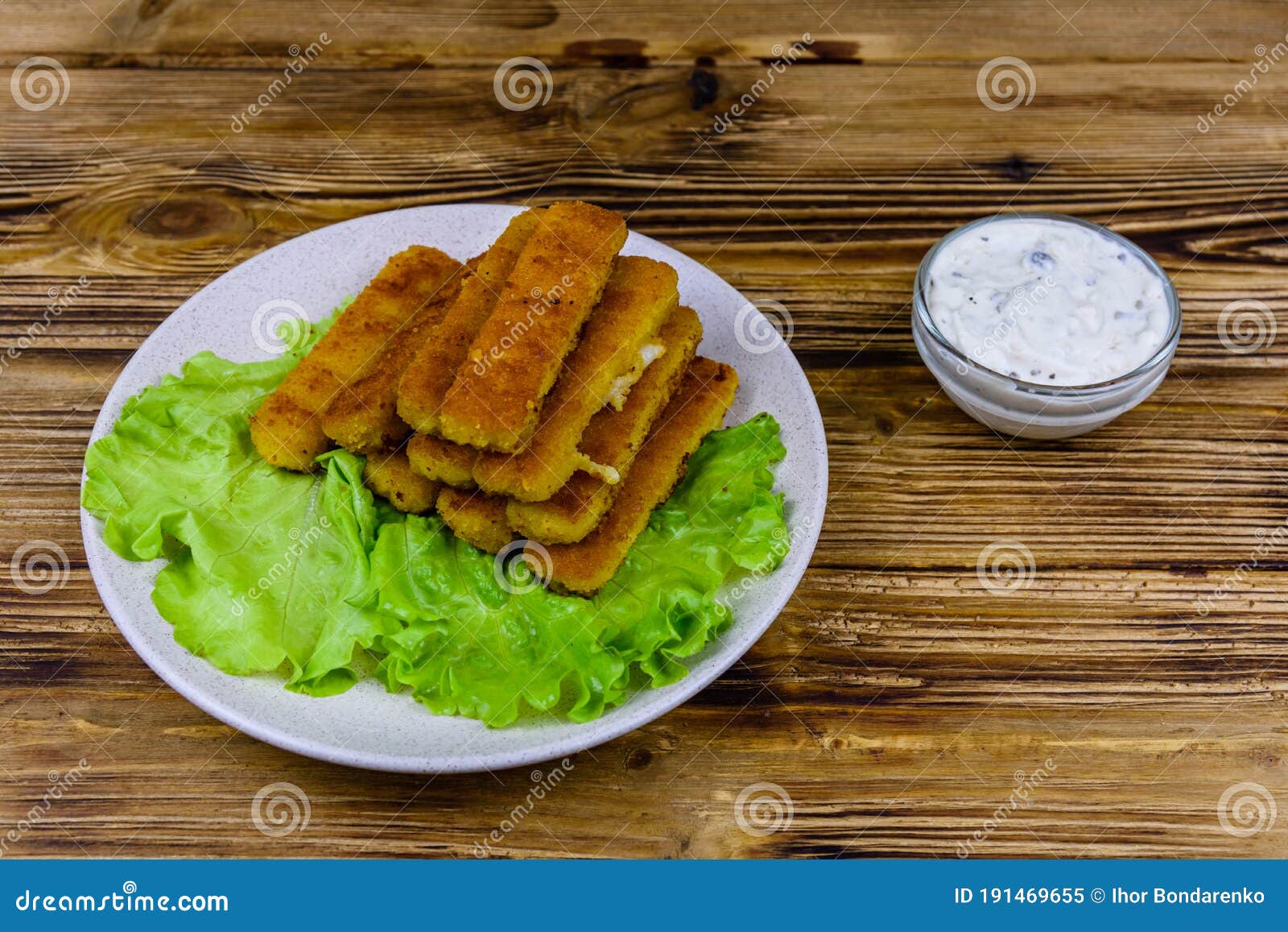 Baked Fish Sticks and Lettuce Leaves in a Plate Stock Image - Image of ...
