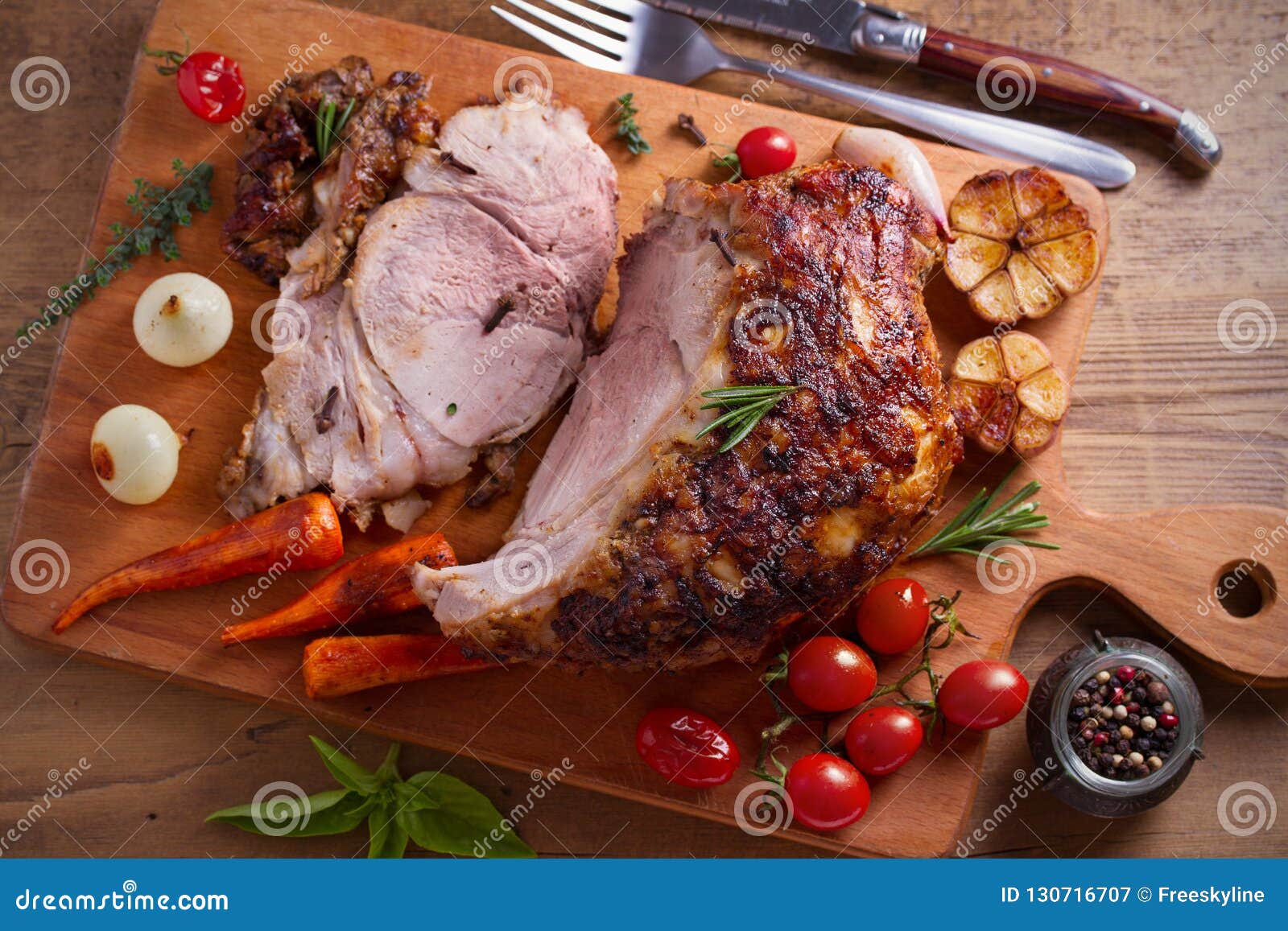 Baked Ham with Vegetables, Rosemary and Thyme on Chopping Board. Stock ...