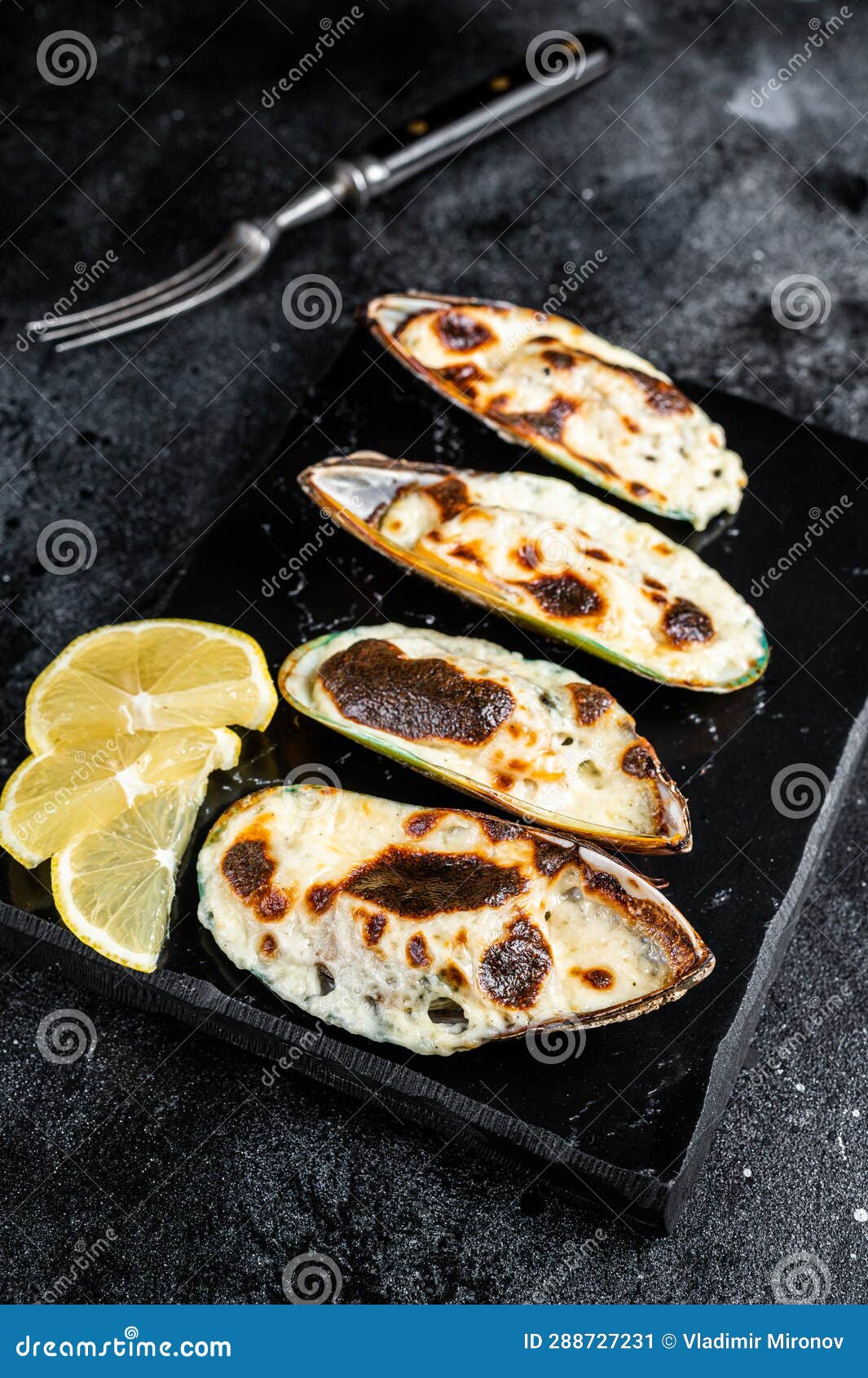 Baked Mussels with Cheese and Lemon in Shells. Black Background Stock ...