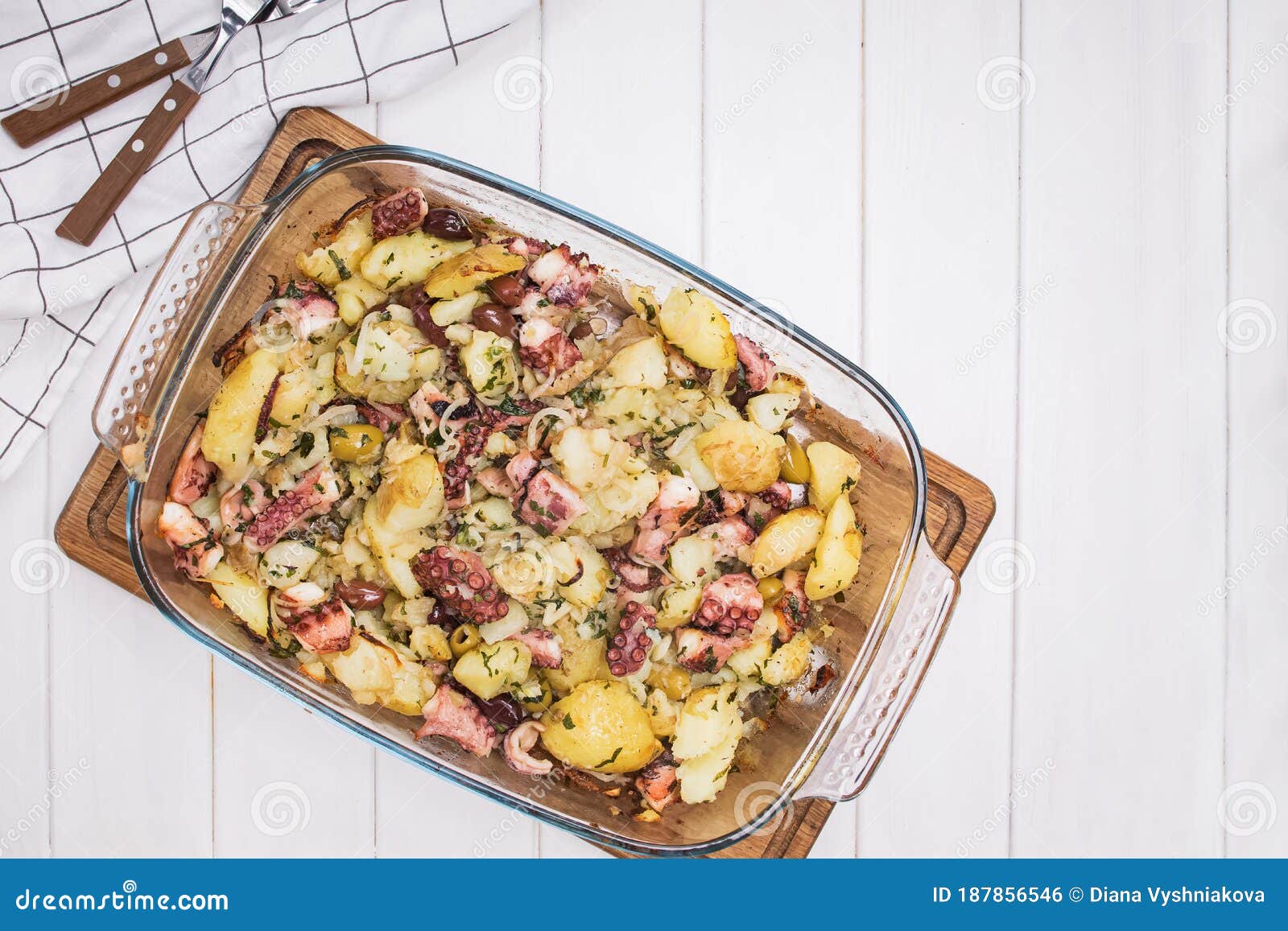 Baked Octopus with Potato and Olives on White Table, Top View Stock ...