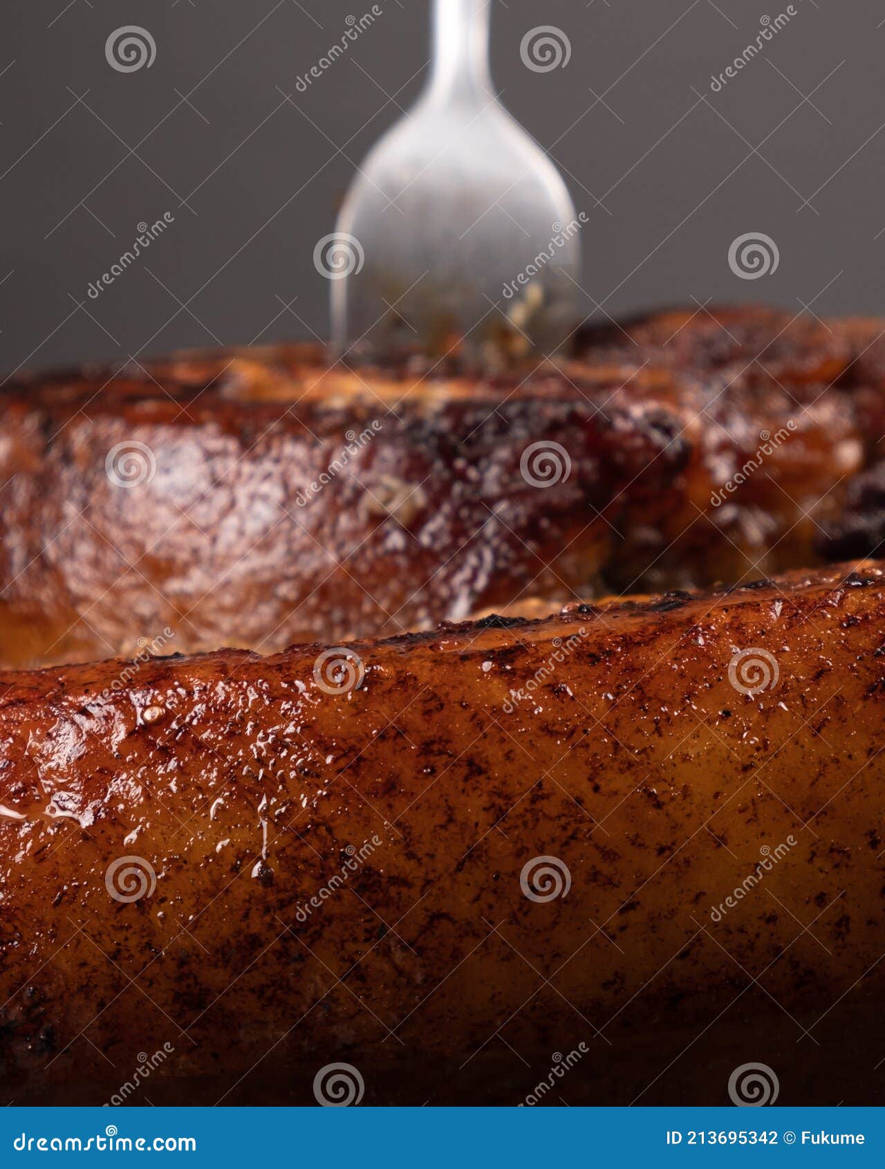 Baked Piece of Pork Pierced with a Fork Close-up Stock Photo - Image of ...