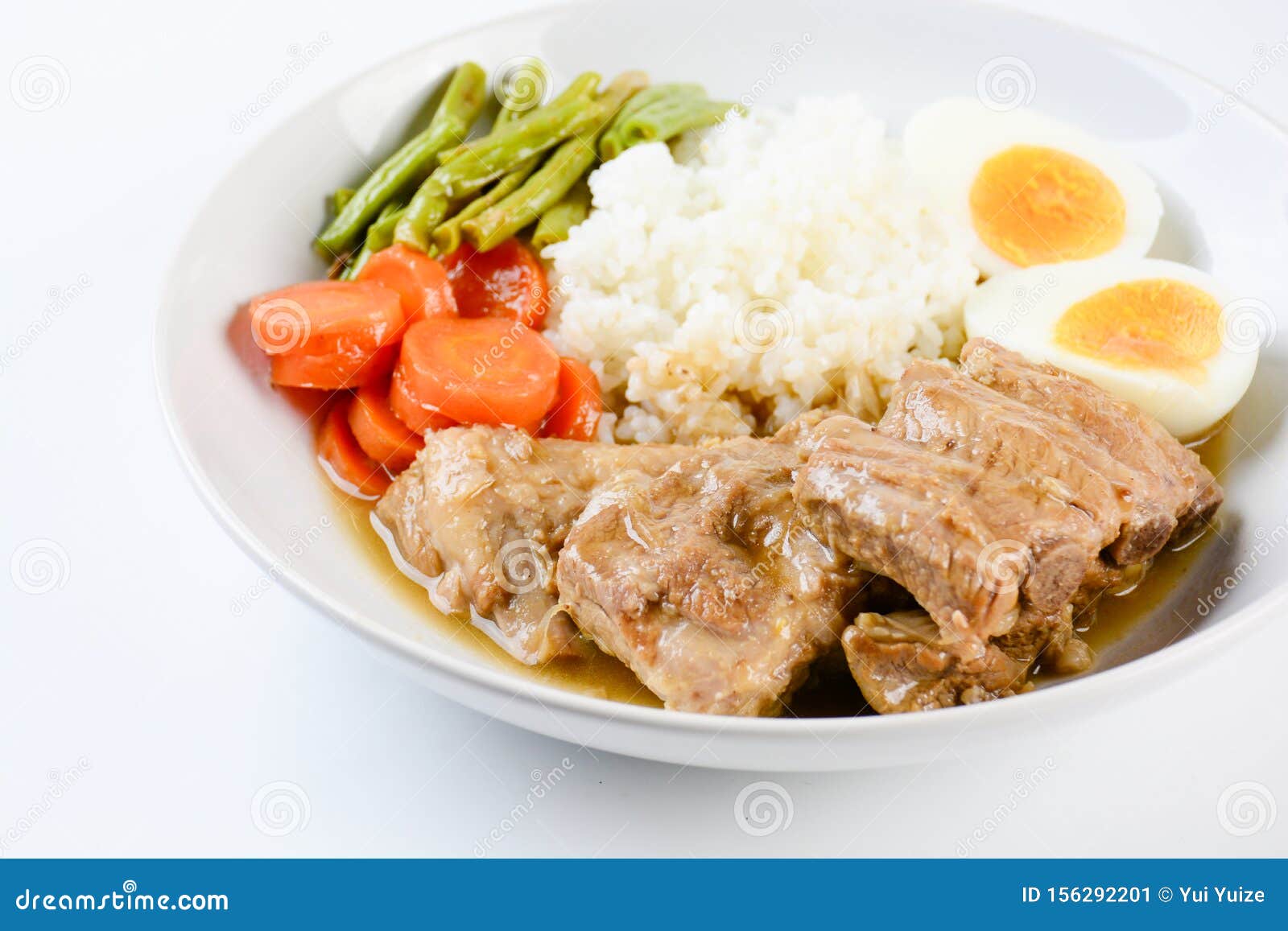 Baked pork ribs with rice stock image. Image of board - 156292201