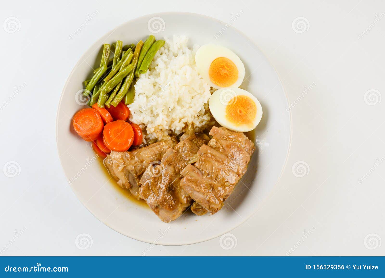 Baked pork ribs with rice stock photo. Image of background - 156329356