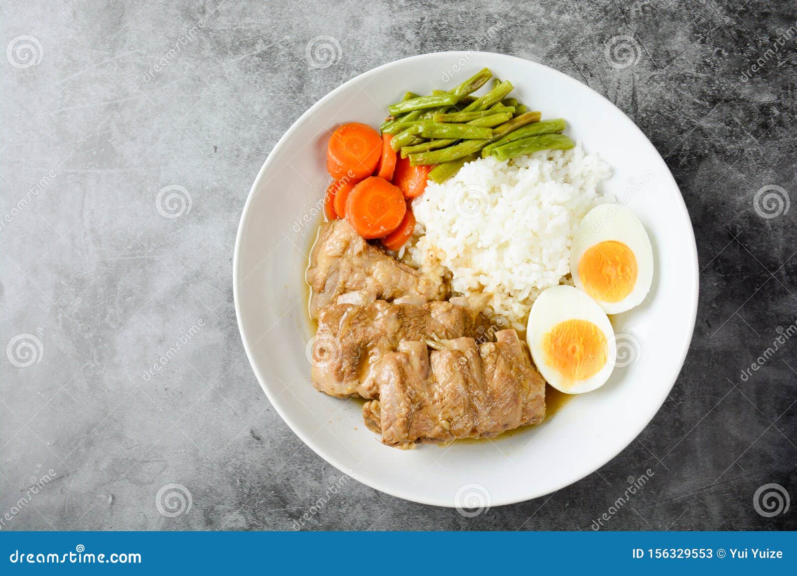 Baked pork ribs with rice stock image. Image of meal - 156329553