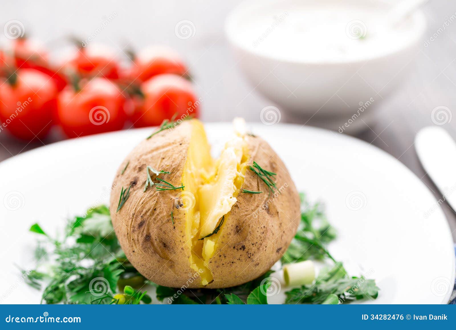 Baked potato with butter stock photo. Image of plate - 34282476