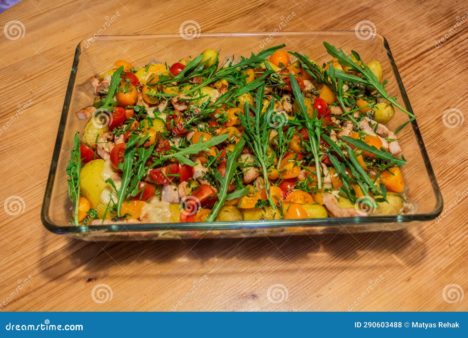 Baked Potatoes, Meat and Vegetables Covered in Rock Stock Photo - Image ...