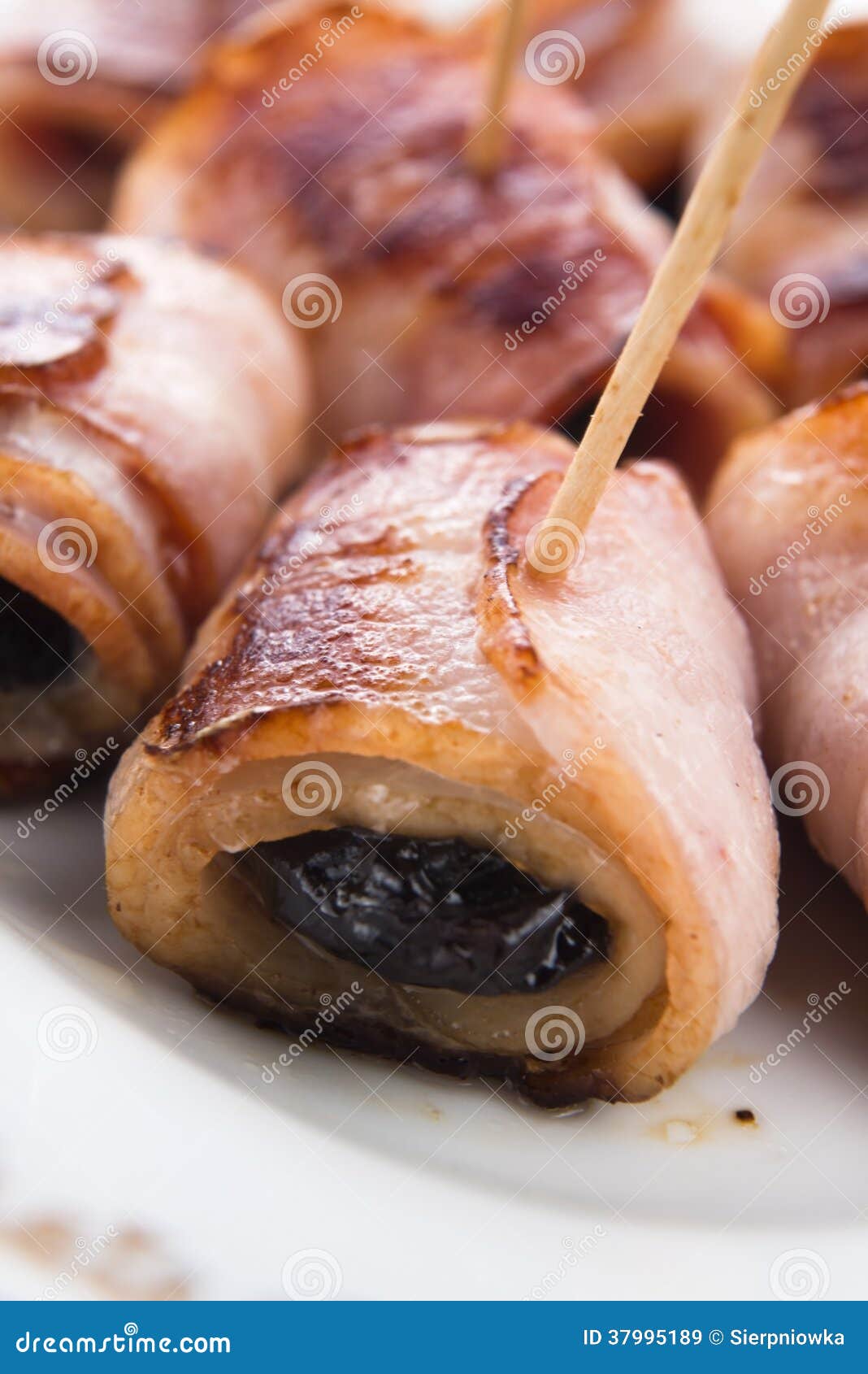 Baked prunes in bacon stock image. Image of rasher, baked - 37995189