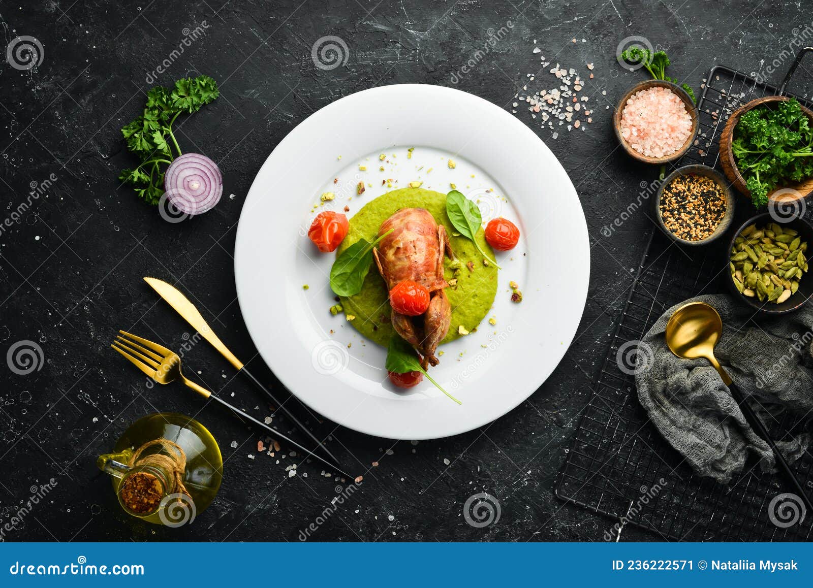 Baked Quail in Bacon with Spinach Hummus on a White Plate. Stock Image ...