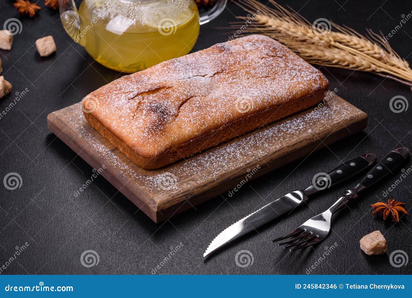 Baked Rectangular Cupcake with Raisins and Chocolate on a Dark Concrete ...
