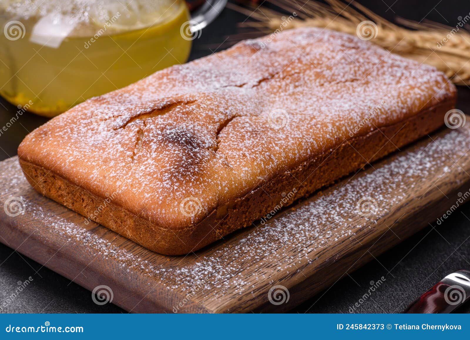 Baked Rectangular Cupcake with Raisins and Chocolate on a Dark Concrete ...