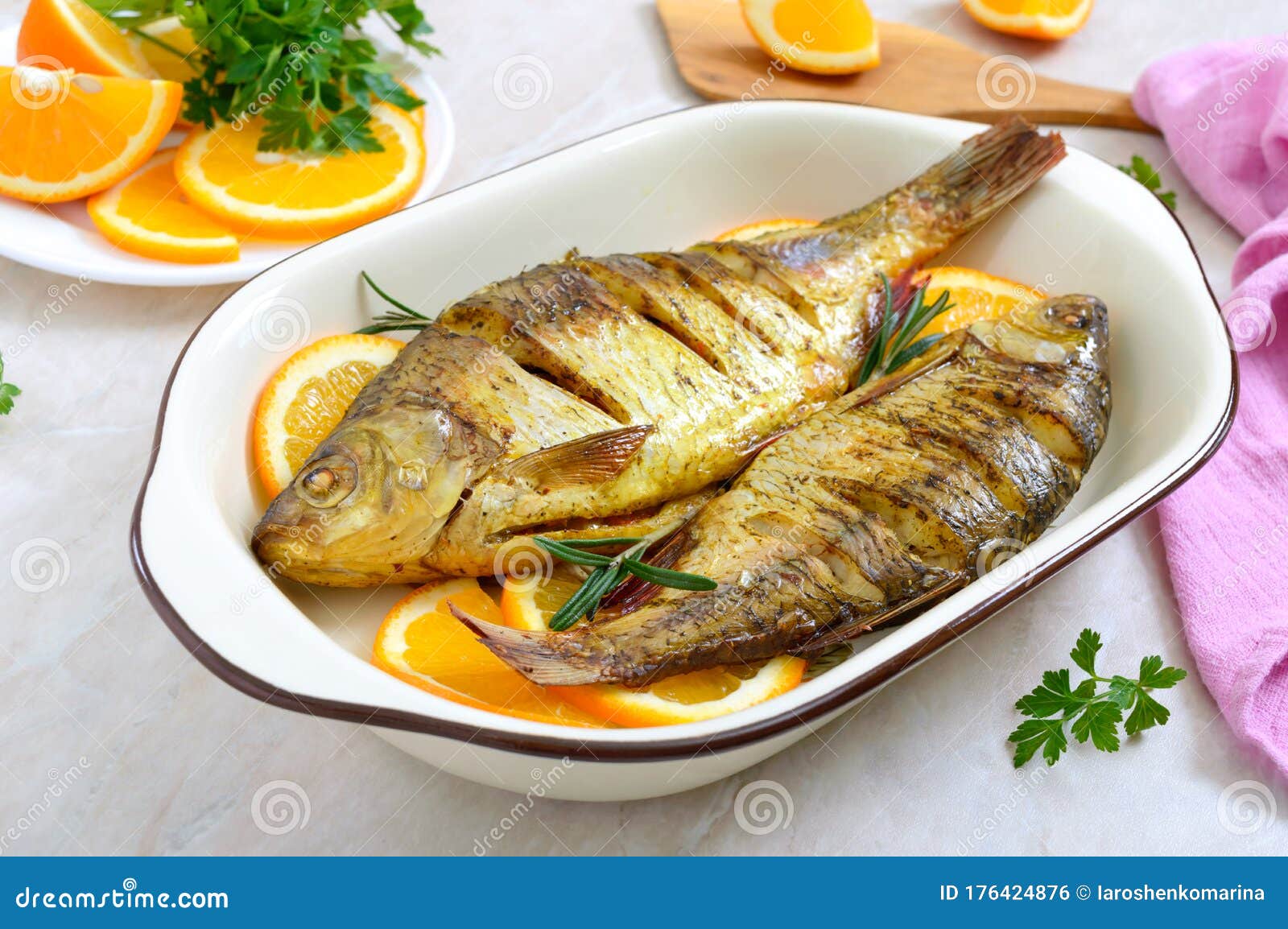 Baked Roach Fish with Vegetables and Oranges in a Ceramic Bowl. Diet ...