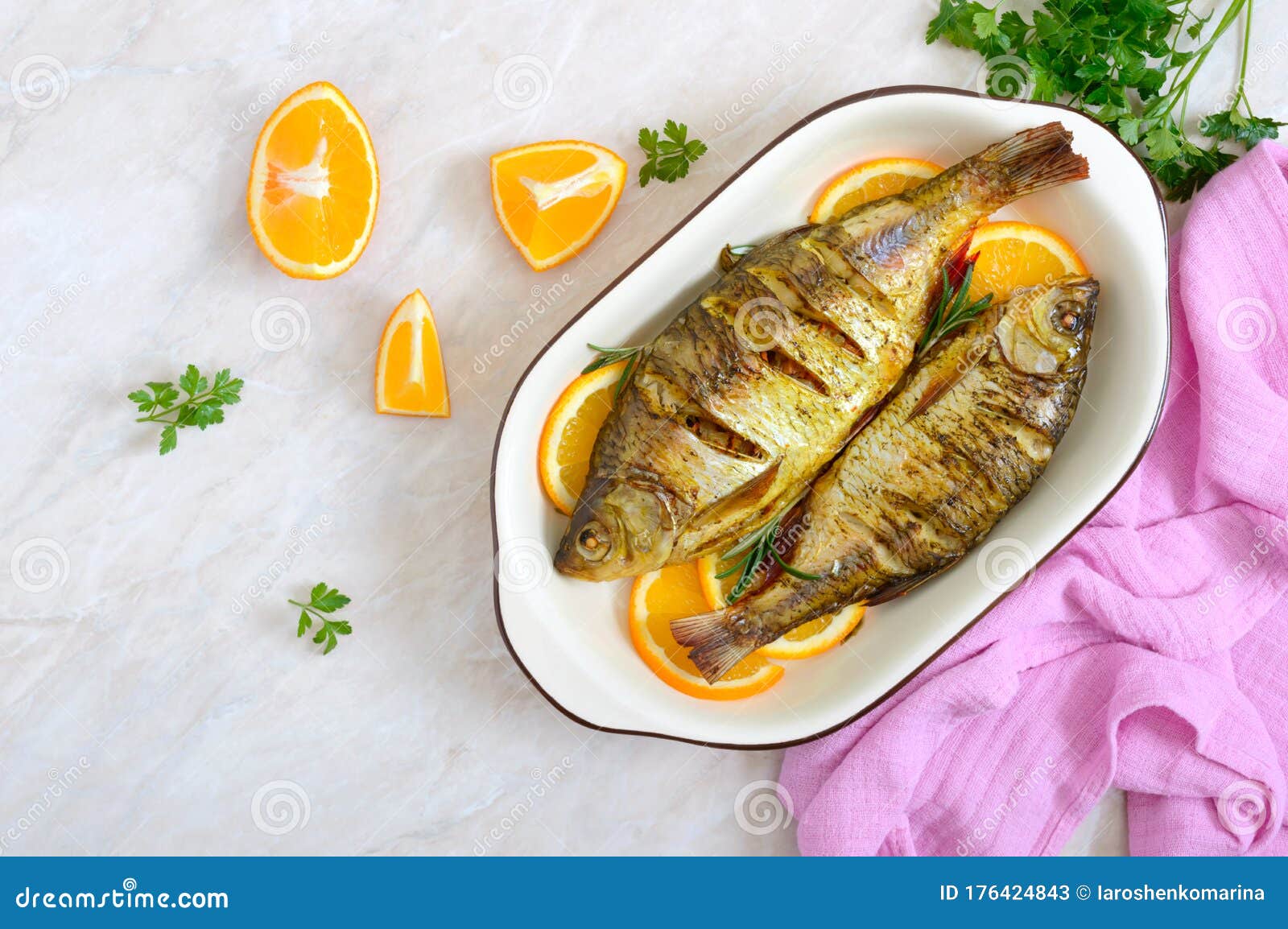 Baked Roach Fish with Vegetables and Oranges in a Ceramic Bowl. Top ...