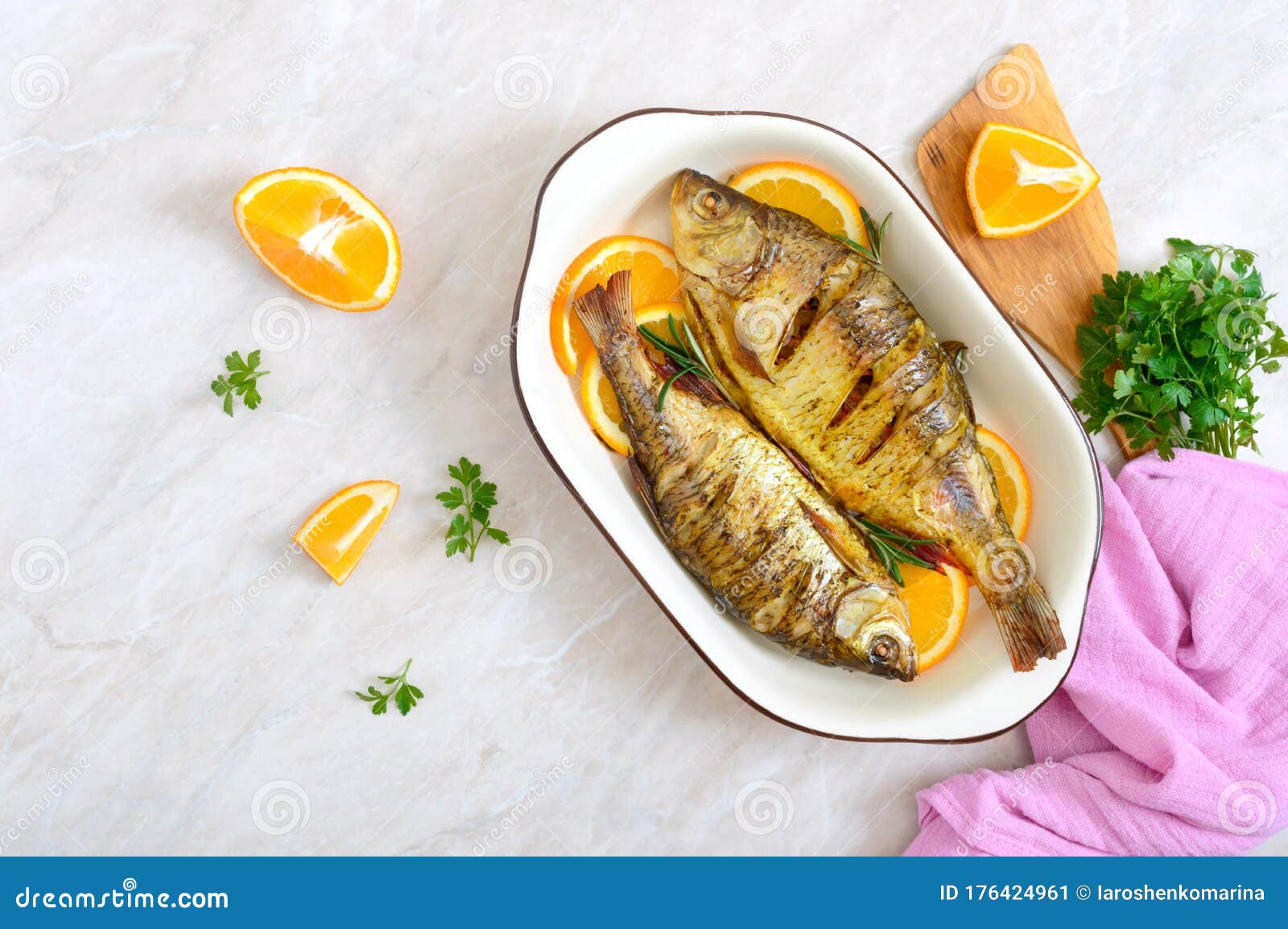 Baked Roach Fish with Vegetables and Oranges in a Ceramic Bowl. Top ...