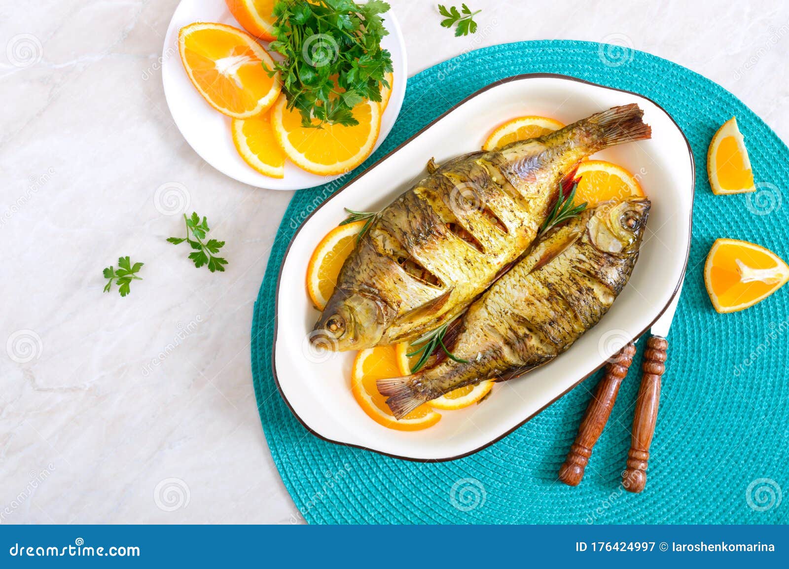 Baked Roach Fish with Vegetables and Oranges in a Ceramic Bowl. Top ...