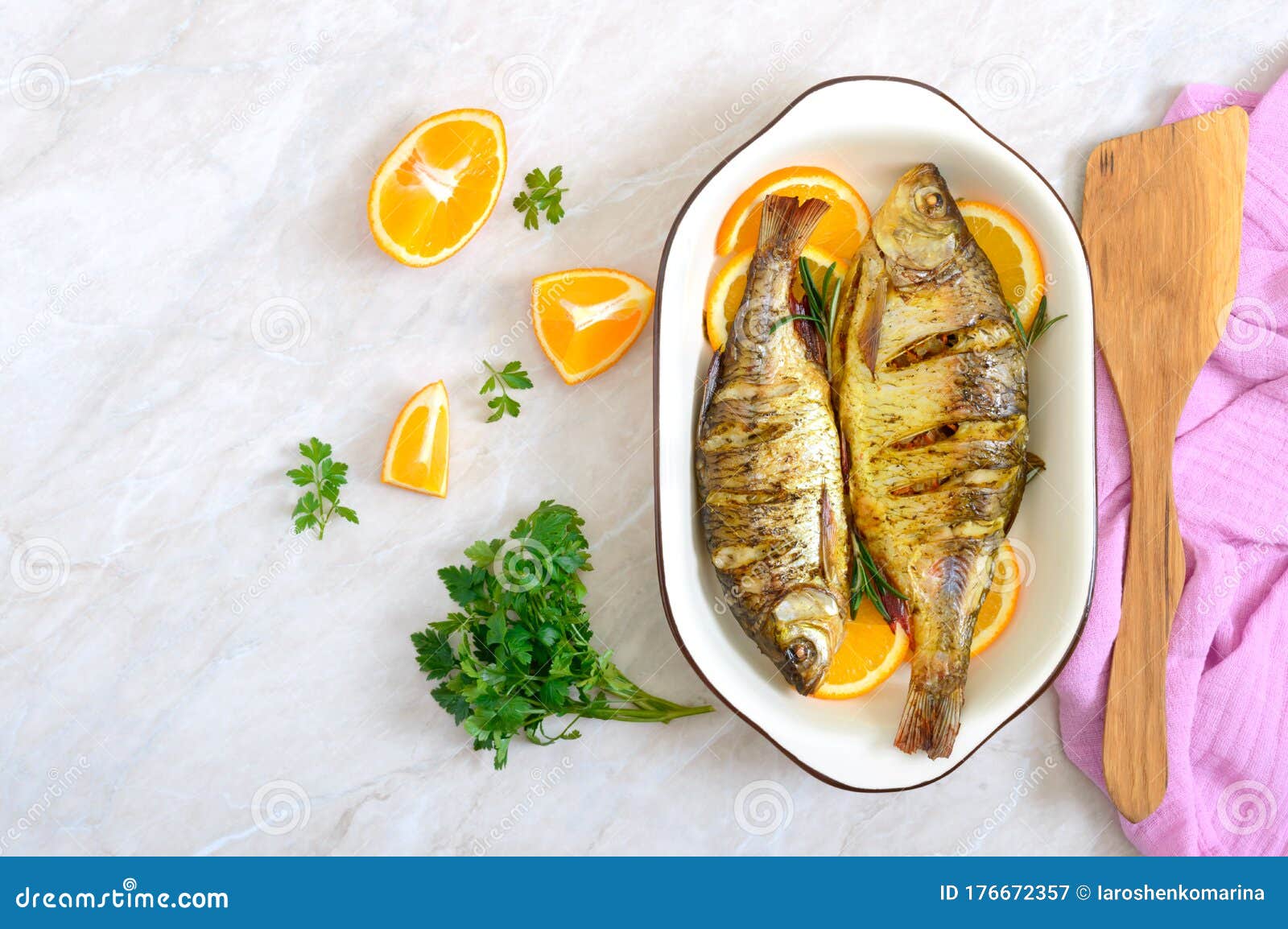 Baked Roach Fish with Vegetables and Oranges in a Ceramic Bowl. Top ...