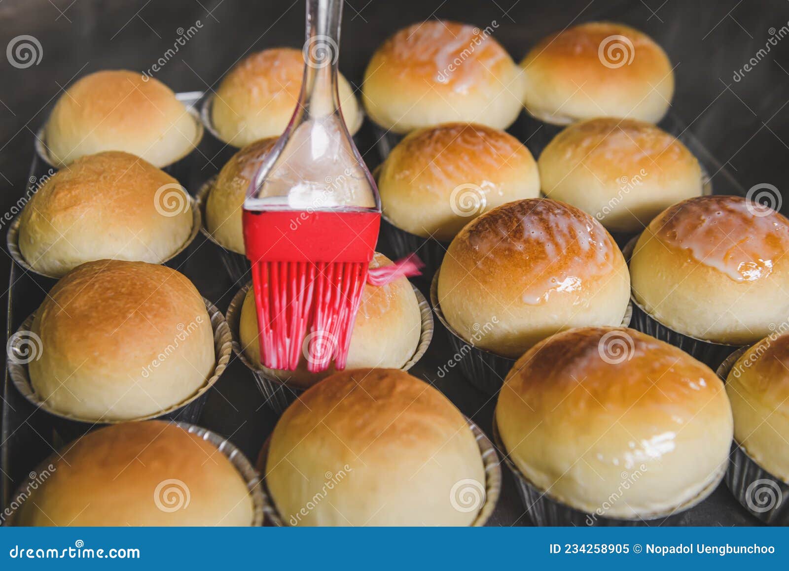 Baked Round Toasted Bread in Cups with Butter Brushing Stock Image ...
