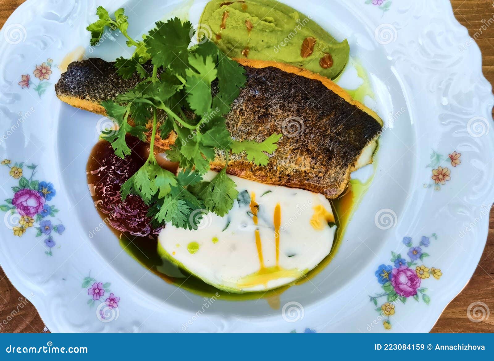 Baked Sibas Fish Fillet Garnished with Vegetables Stock Image - Image ...