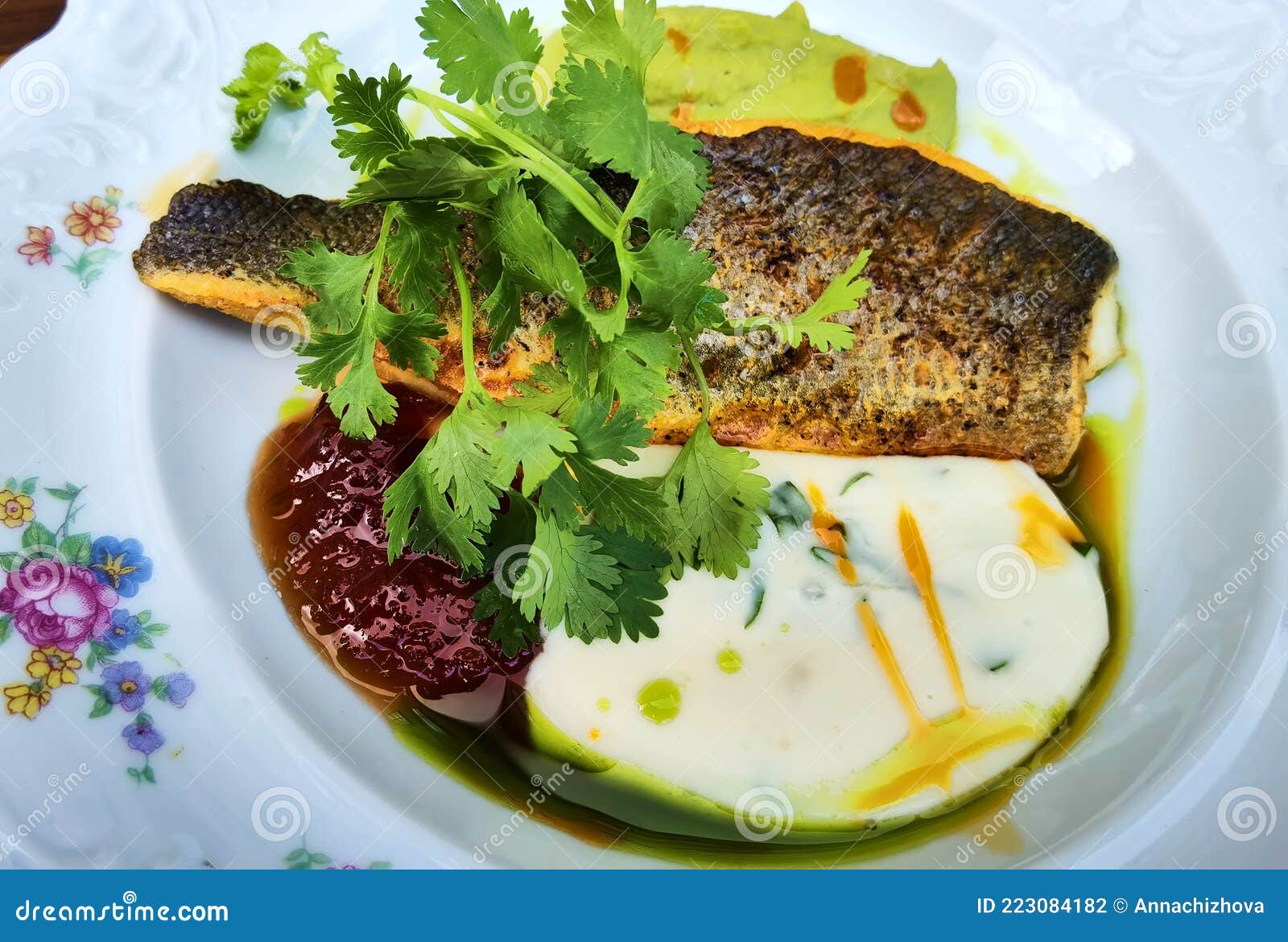 Baked Sibas Fish Fillet Garnished with Vegetables Stock Photo - Image ...