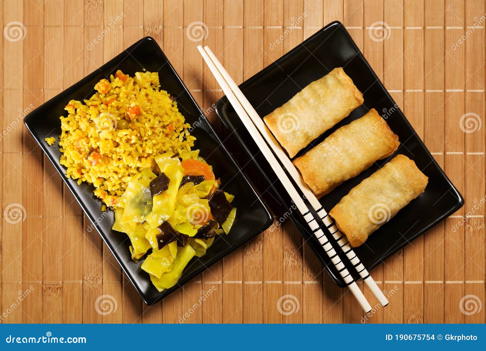 Baked Spring Rolls with Vegetables on a Black Plate Stock Photo - Image ...