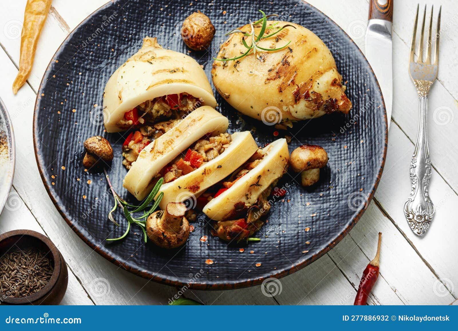 Baked squid on the plate stock photo. Image of mushrooms - 277886932