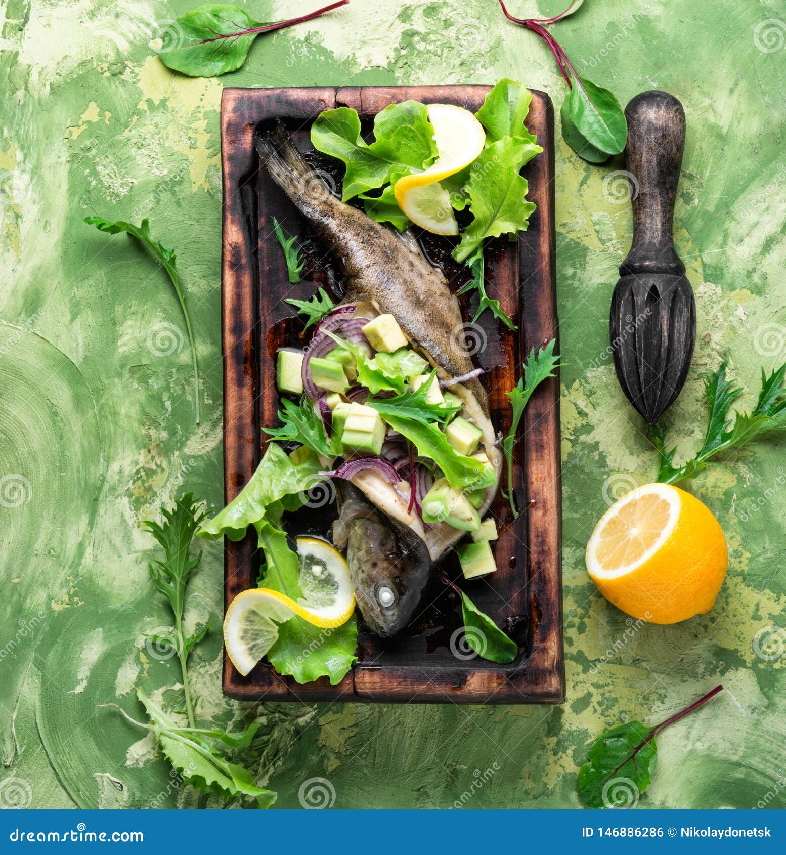 Baked fish with avocado stock photo. Image of appetizing - 146886286