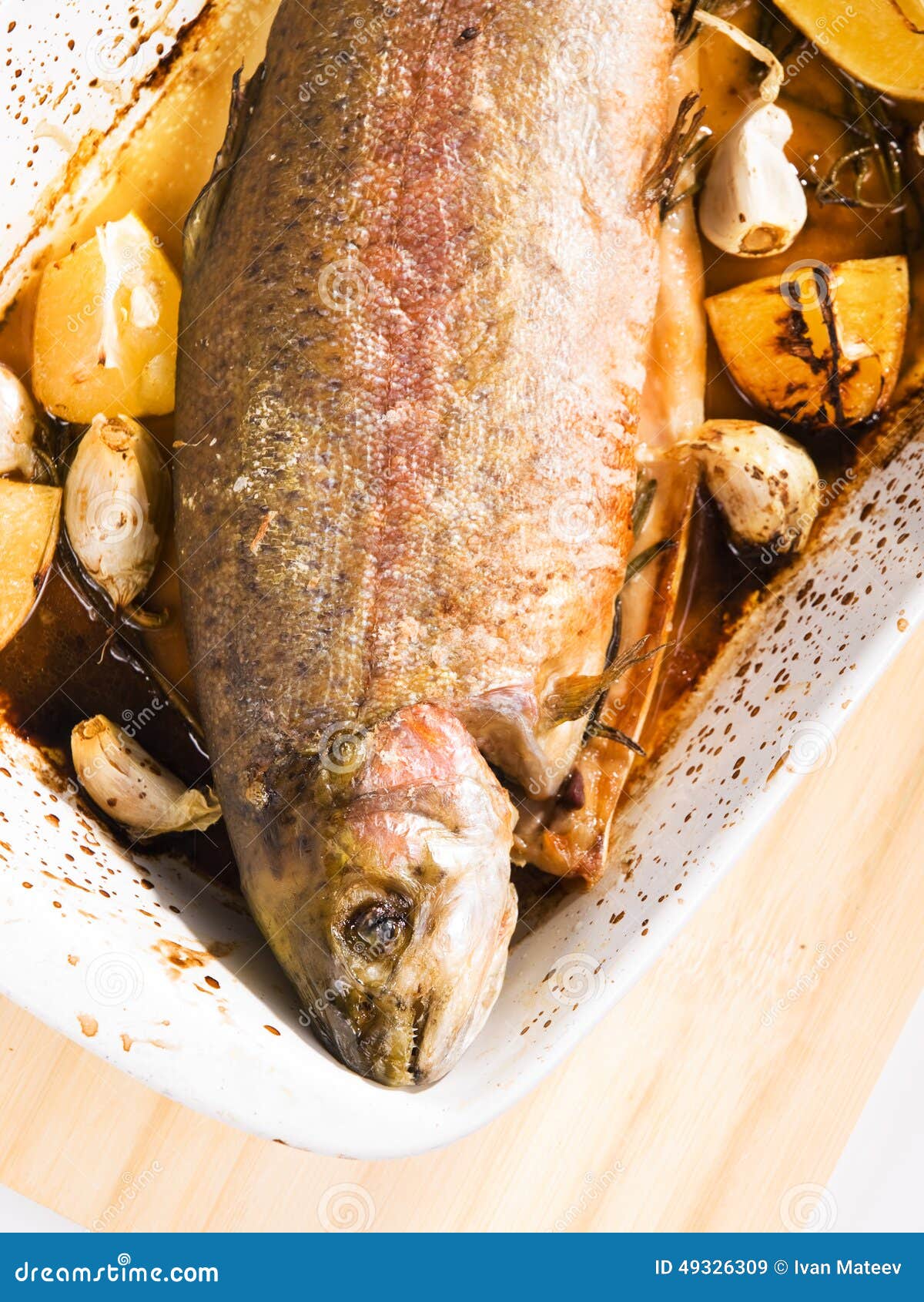 Baked trout with garlic stock image. Image of fish, life - 49326309