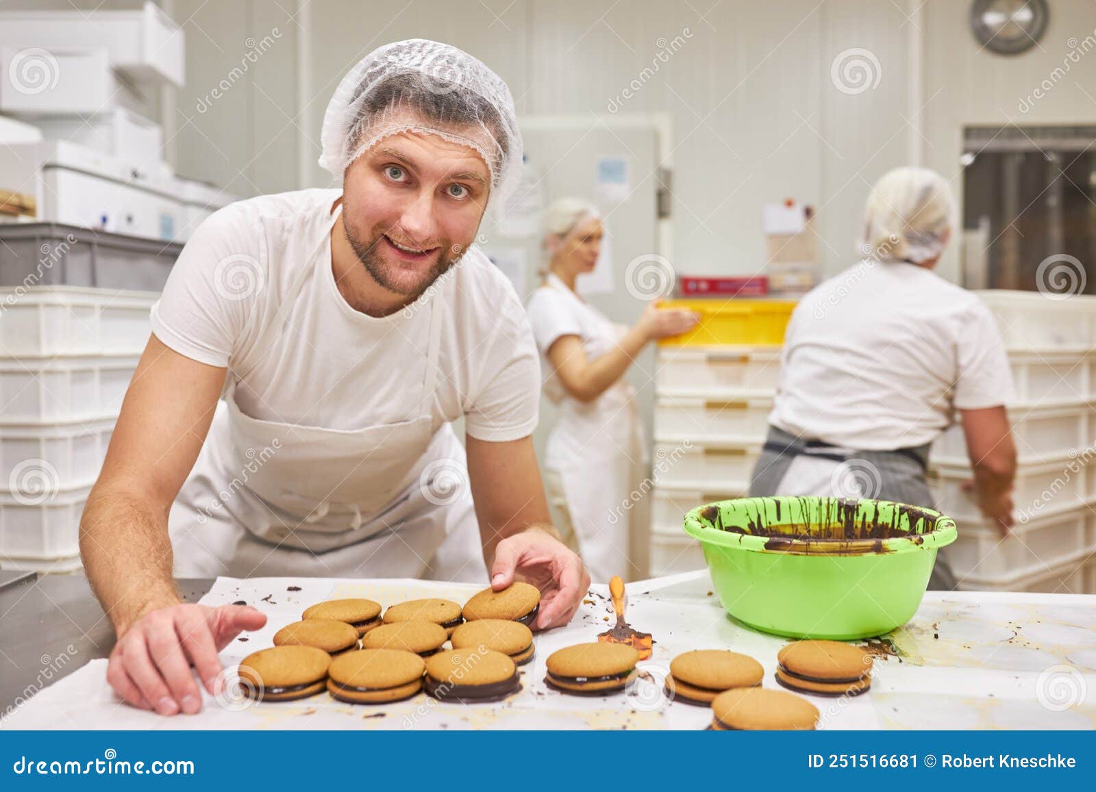 Baker Apprentice Decorates Double Biscuits with Chocolate Stock Image ...