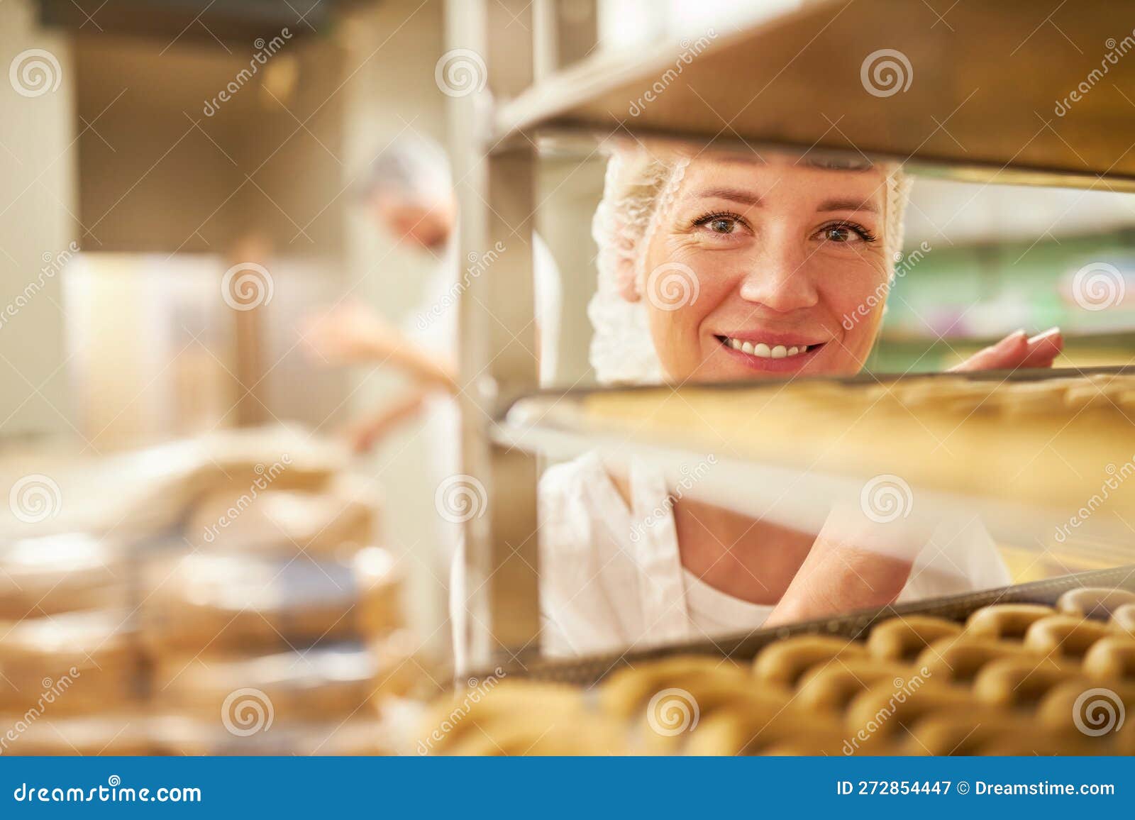 Baker Apprentice in Front of a Shelf with Vanilla Crescents Stock Image ...
