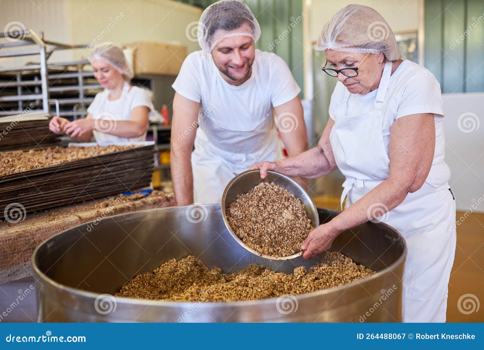 Baker Apprentice and Senior Baker Mixing Grains Stock Image - Image of ...