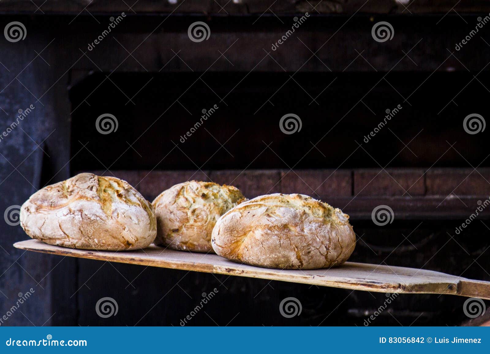 Baker Baking Fresh Handmade Bread in the Bakery Stock Photo - Image of ...