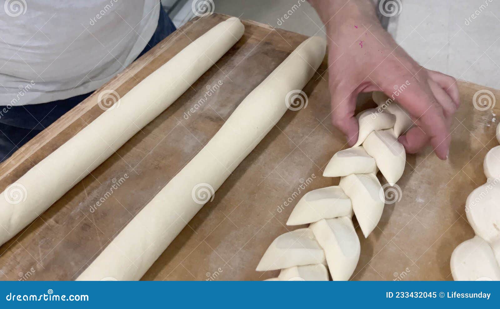 Baker Cutting Flour Dough To Make Loaf of Bread. Baker Making Bread ...