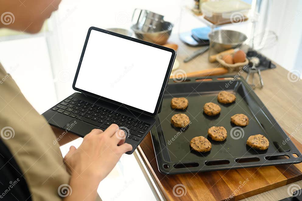 Baker Checking Recipe on Digital Tablet while Preparing Chocolate Chip ...