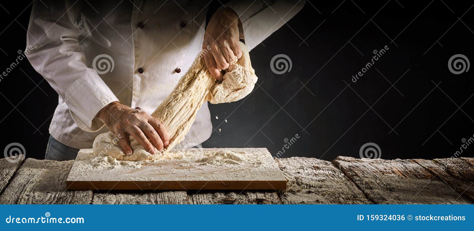 Baker or Chef Stretching a Portion of Raw Dough Stock Photo - Image of ...