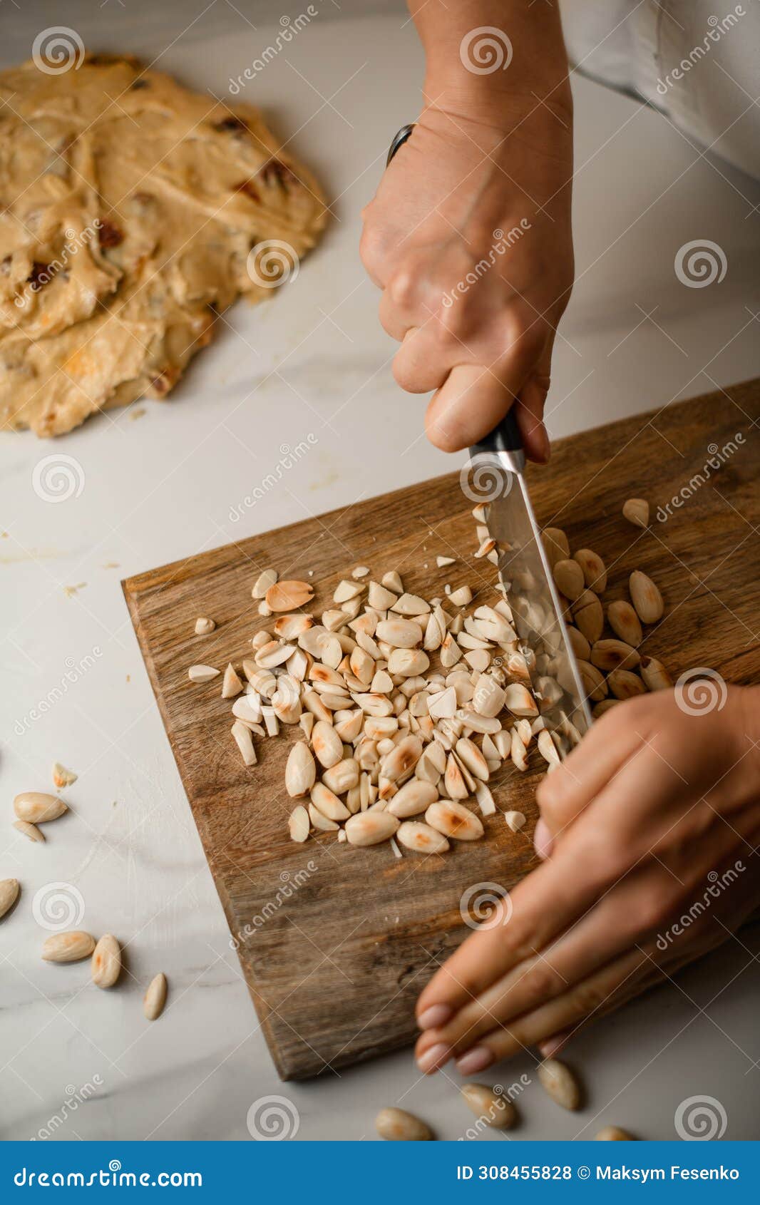 Baker Cuts Peanuts on a Cutting Board with a Knife Stock Photo - Image ...