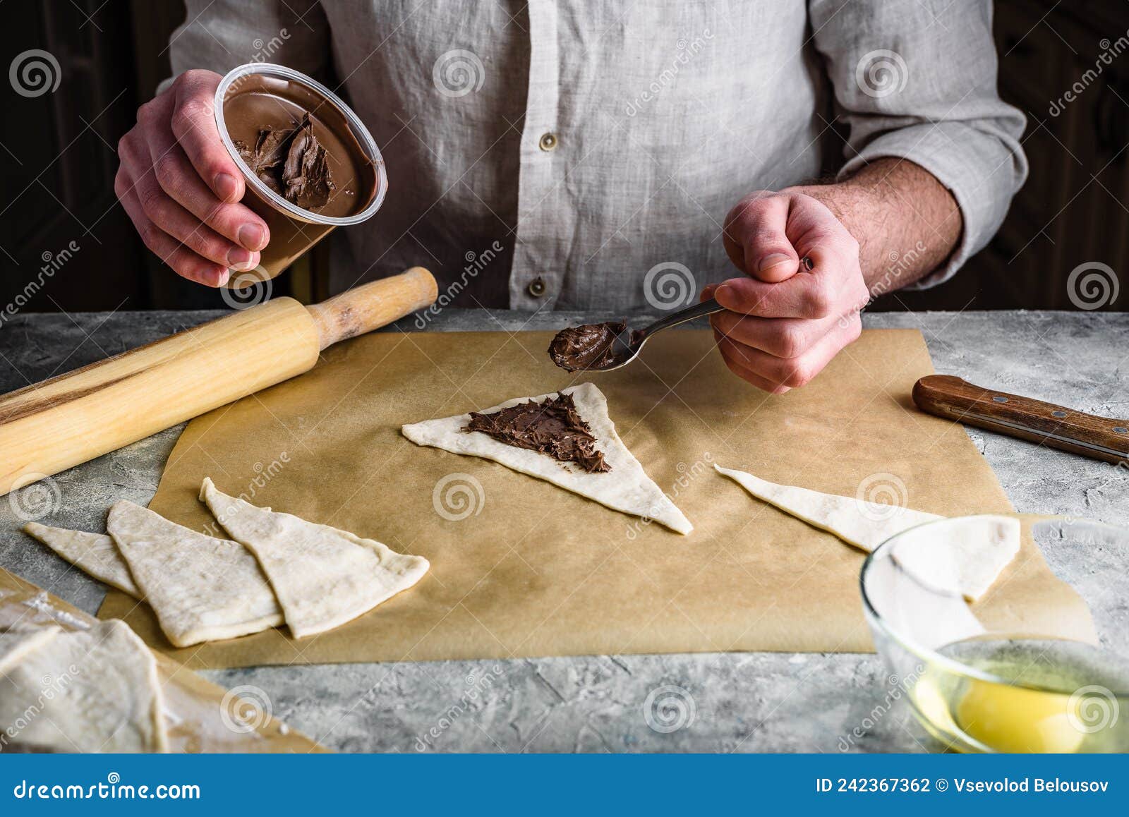 Baker Distributes Hazelnut Spread among Puff Pastry Triangles Stock ...
