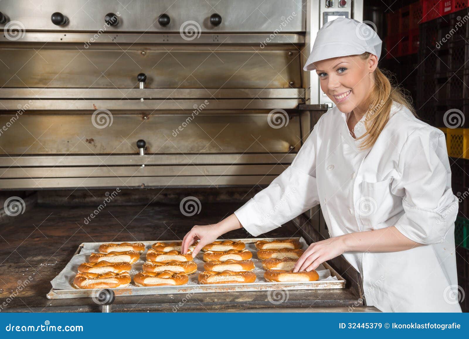 Baker in Front of Oven with Pretzels Inside a Bakery Stock Image ...