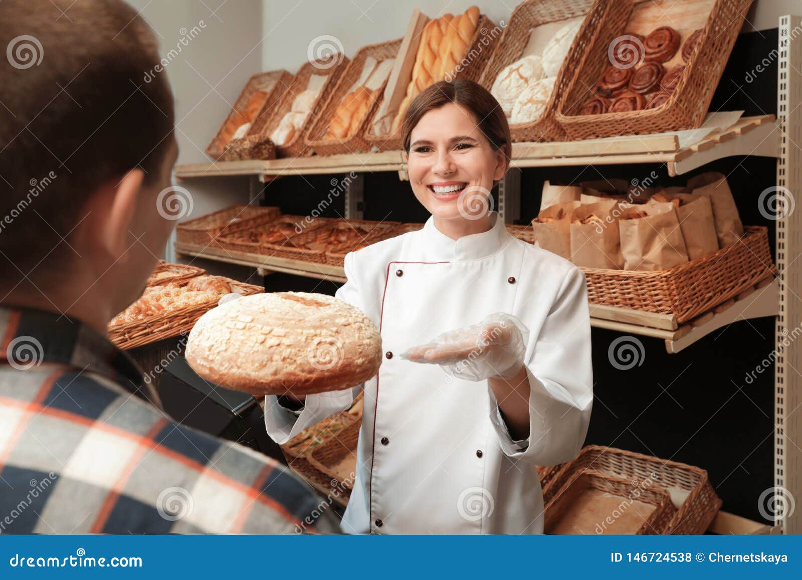 Baker Giving Customer Fresh Bread Stock Photo - Image of baker, people ...