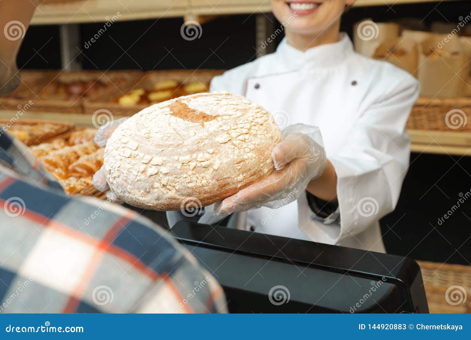 Baker Giving Customer Fresh Bread in Store Stock Image - Image of bread ...