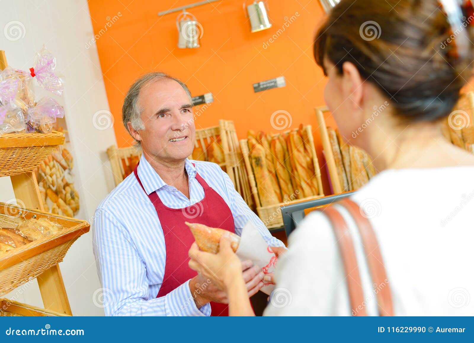 Baker Handling Bread To Customer Stock Photo - Image of order, mixture ...