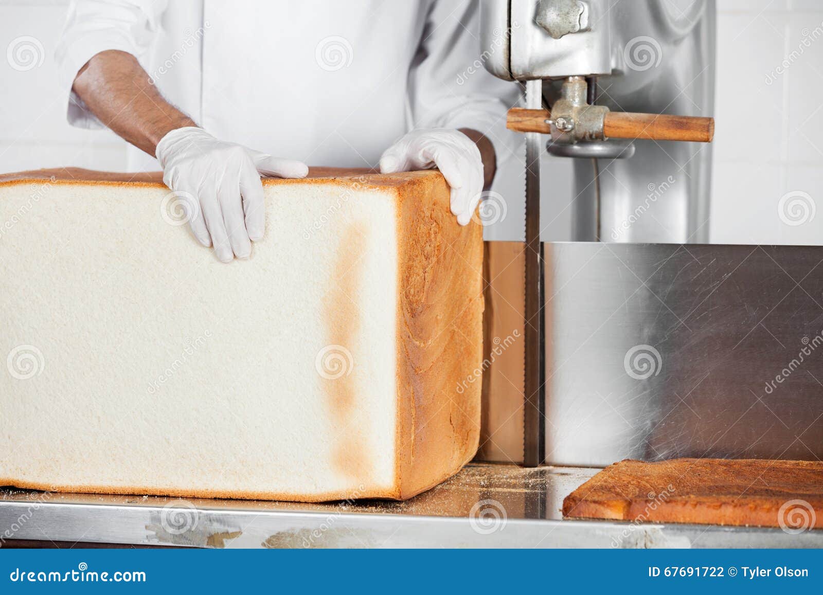 Baker Holding Big Bread Loaf at Cutting Machine in Bakery Stock Photo ...