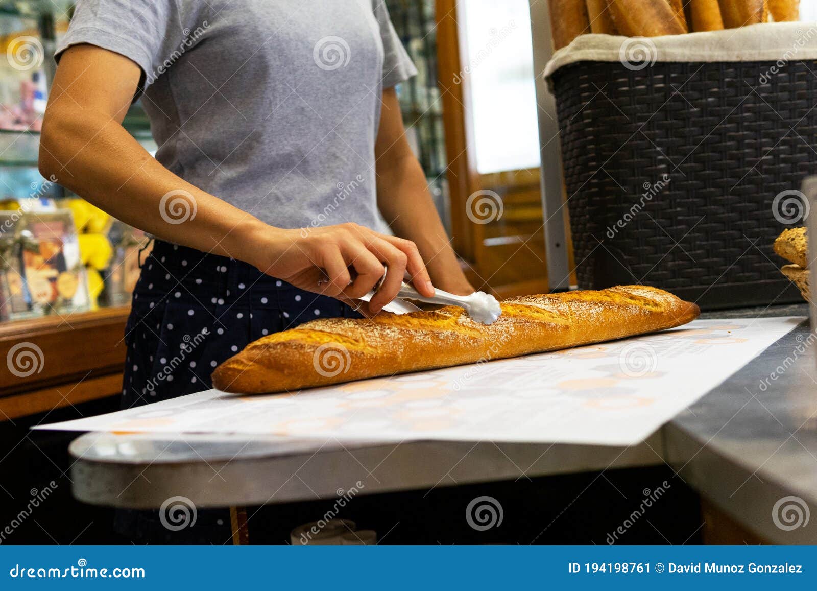 Baker Picking Up a Loaf of Bread. Stock Image - Image of picking, baker ...