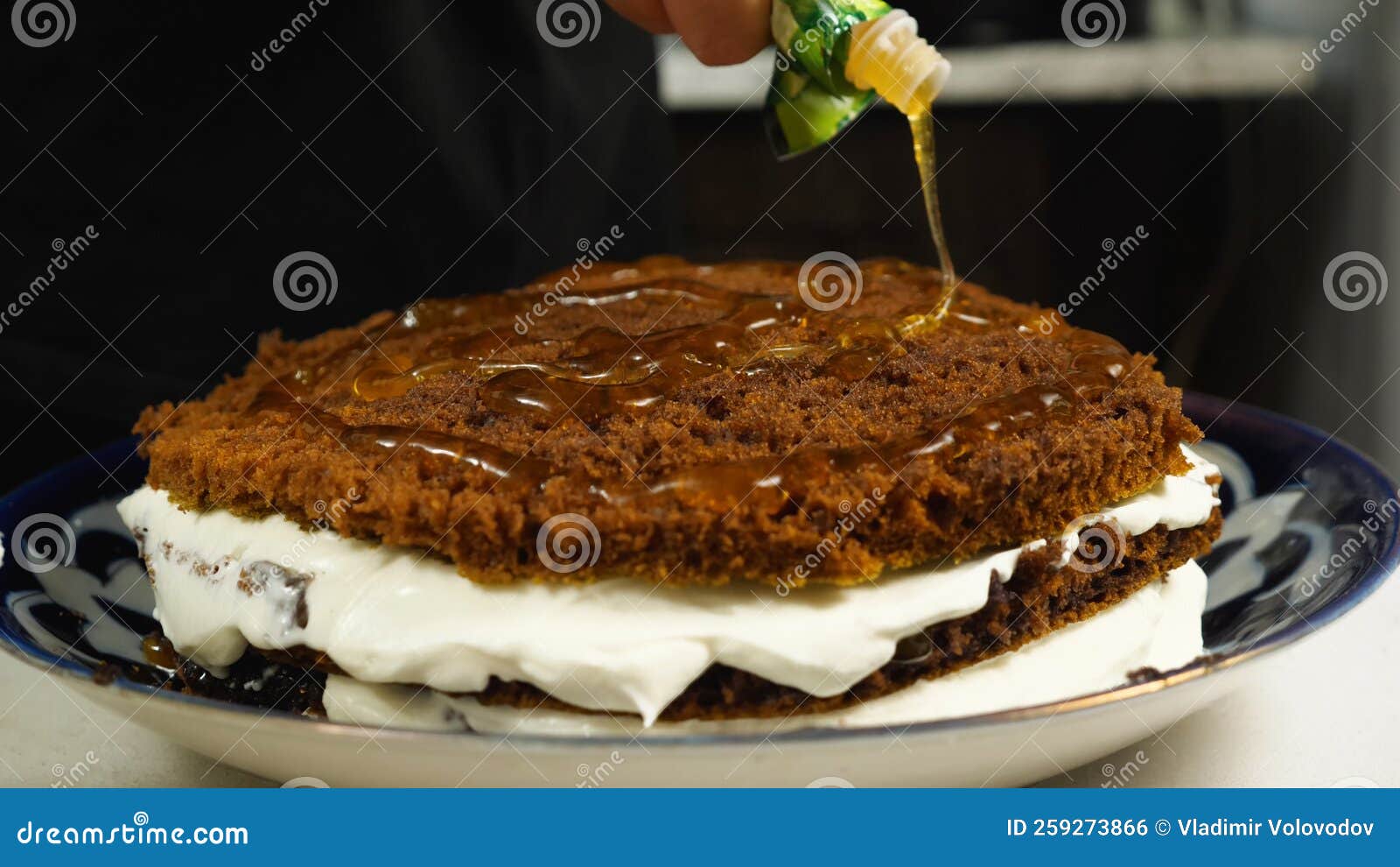 The Baker Puts the Jam on the Dark Biscuit. Soaking the Cake in Jam ...