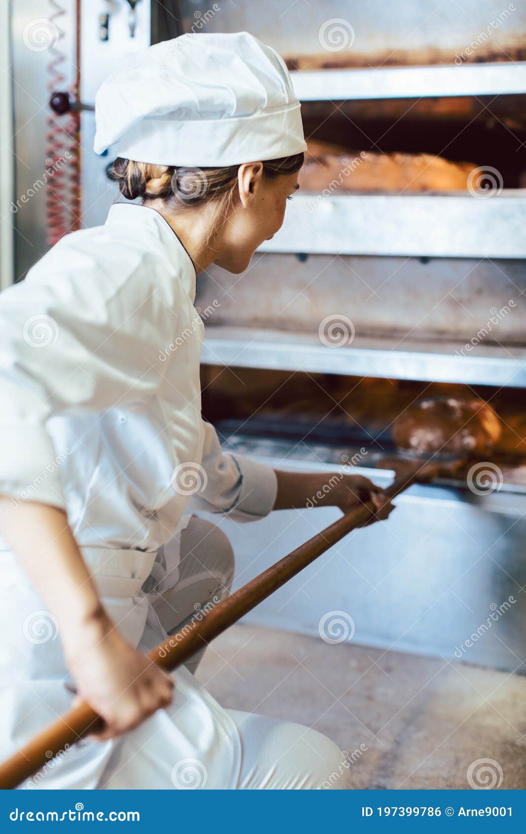Baker Putting Cherry On Cake At Workplace. Chef Man Smiling At Camera ...