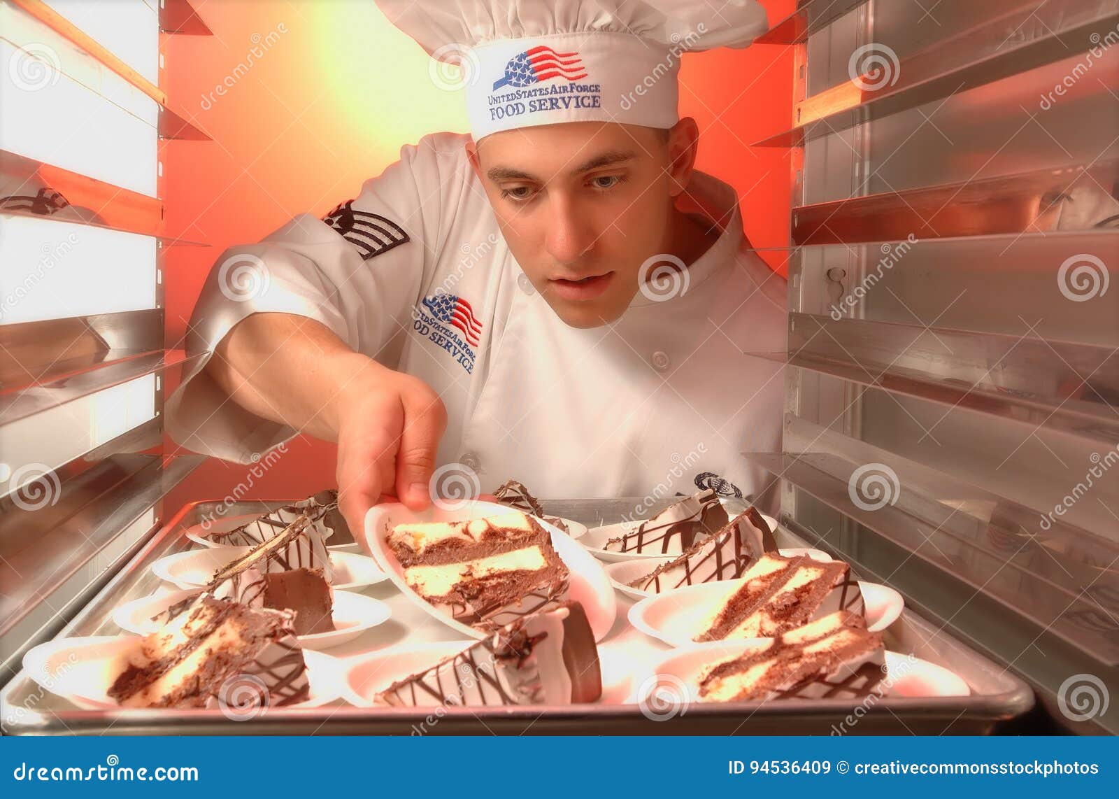 Baker Putting Cake On A Tray Picture. Image: 94536409