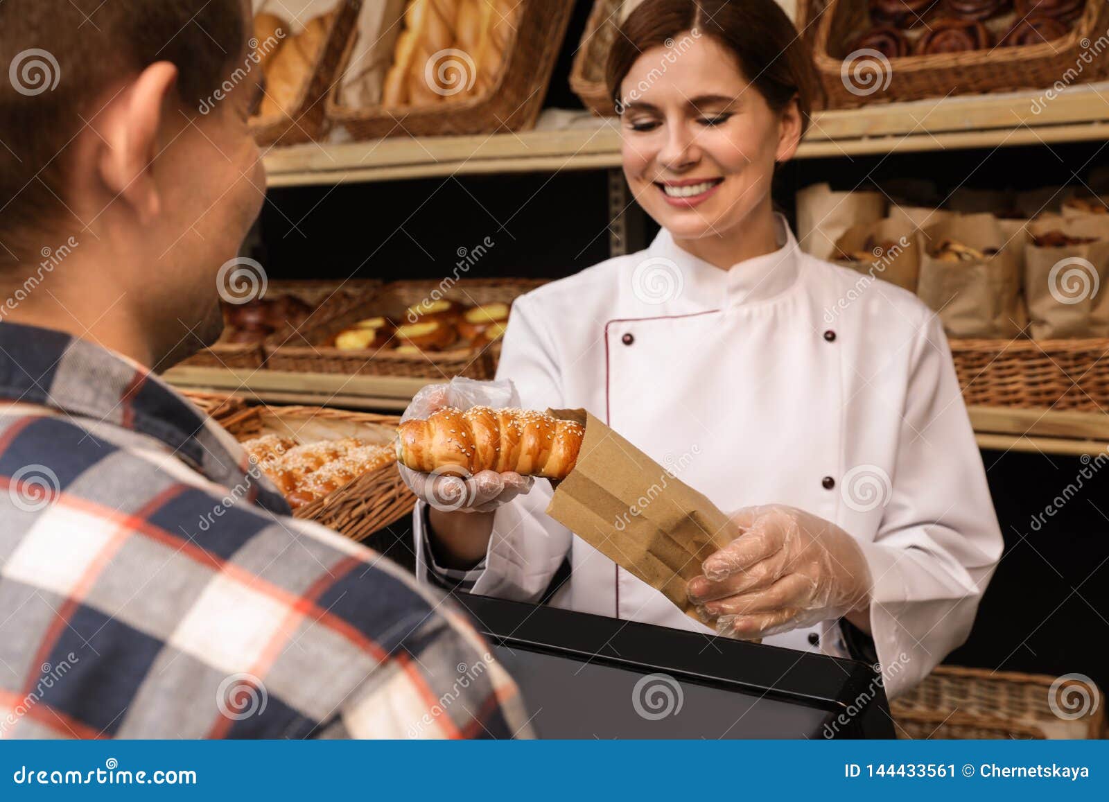 Baker Putting Fresh Bun into Paper Bag Stock Image - Image of handmade ...