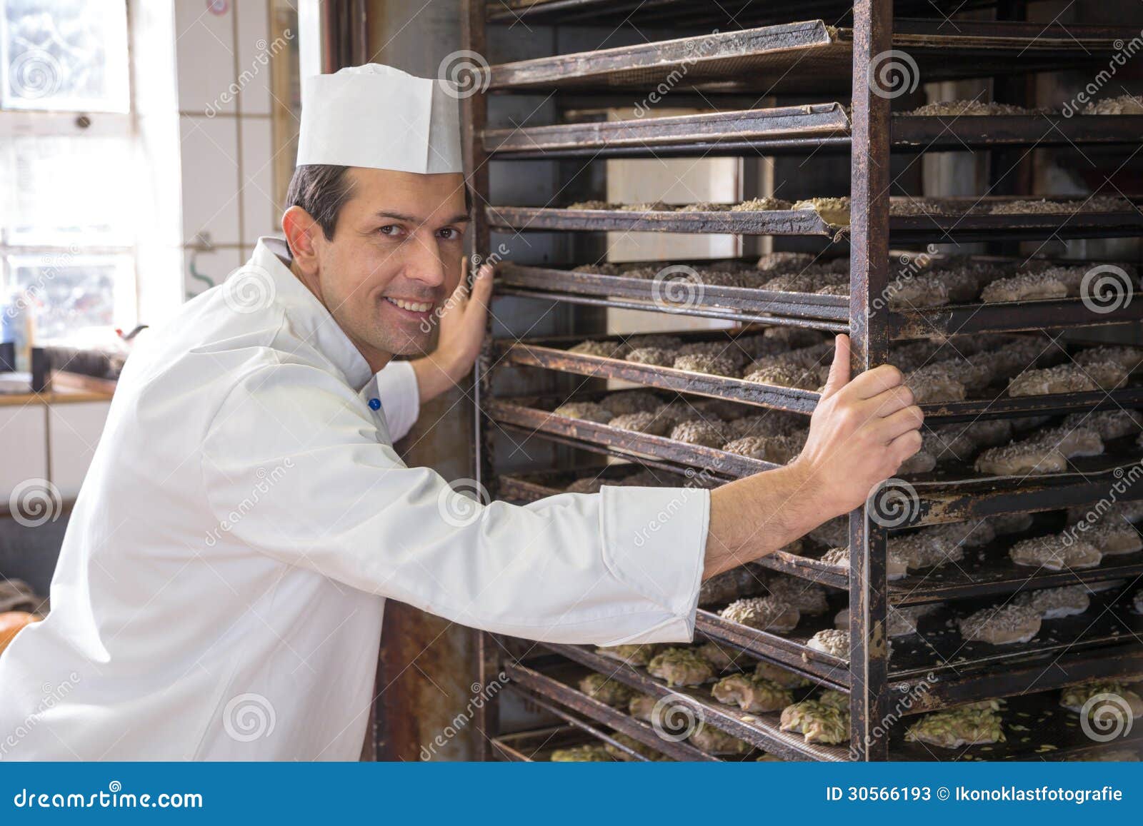 Baker Putting a Rack of Bread into Oven Stock Image - Image of butter ...