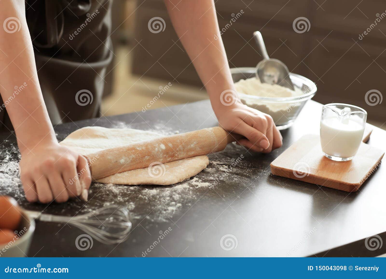 Baker Rolling Dough on Kitchen Table Stock Photo - Image of baking ...