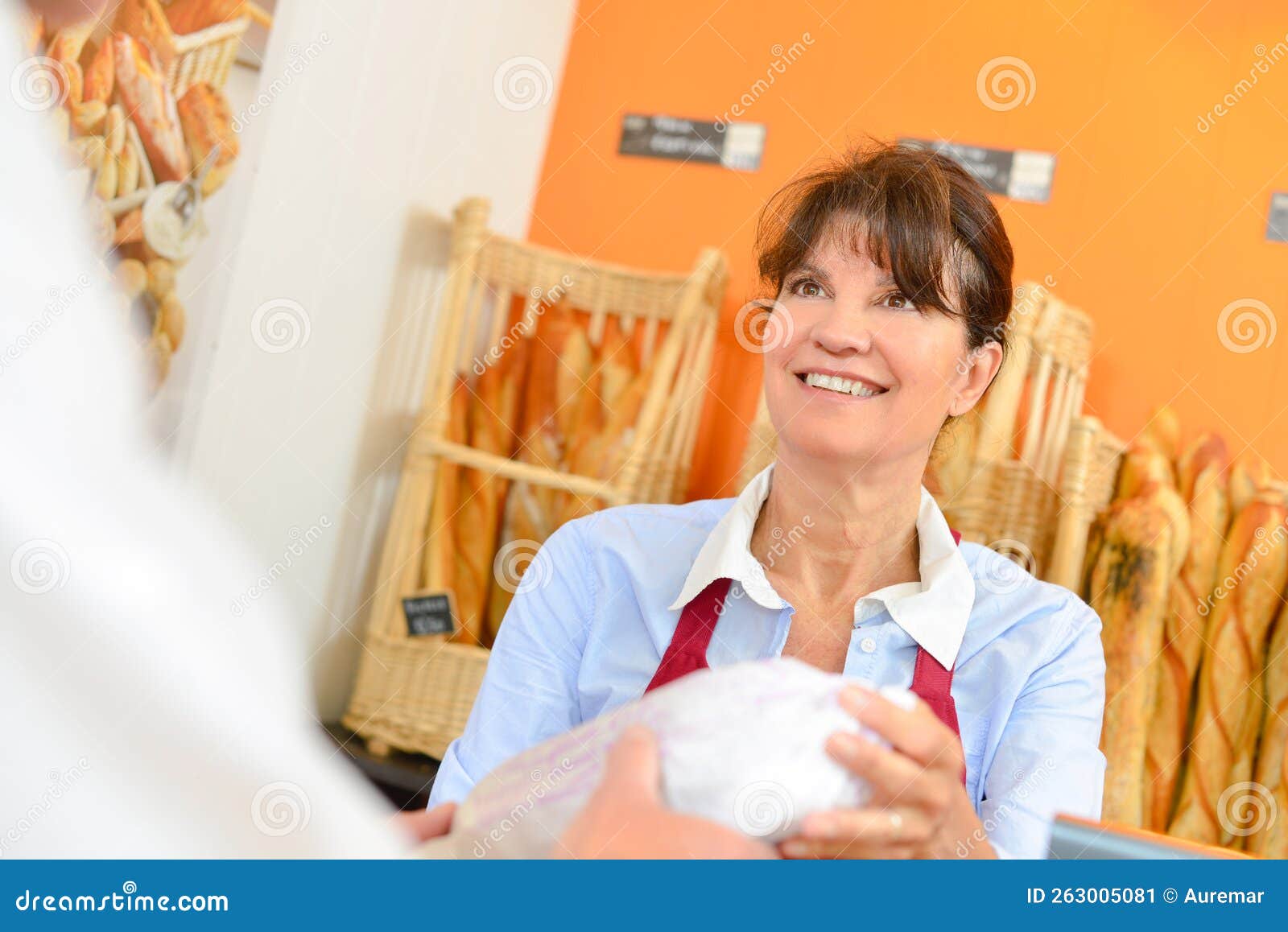 Baker selling bread stock image. Image of bakery, professional - 263005081