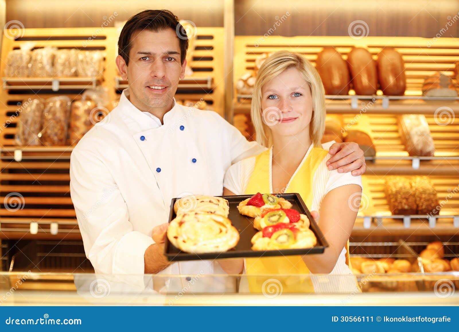 Baker and Shopkeeper in Bakery with Tablet of Cake Stock Image - Image ...