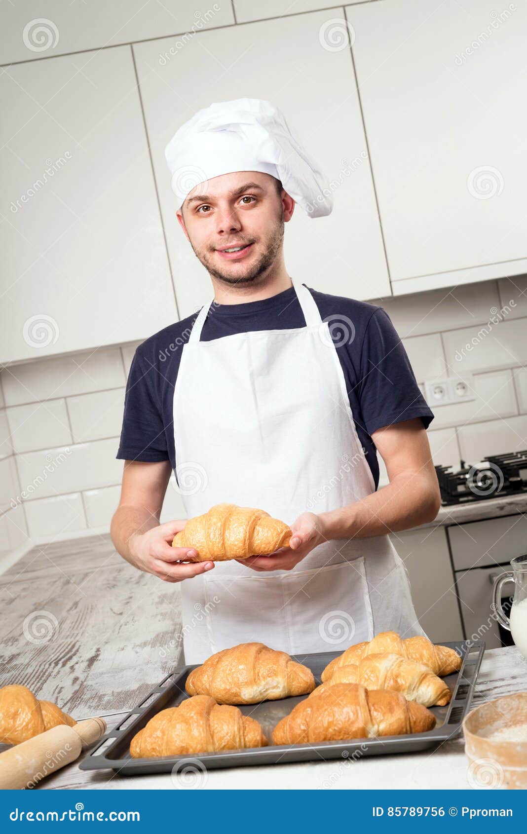 Baker showing croissant stock photo. Image of catering - 85789756